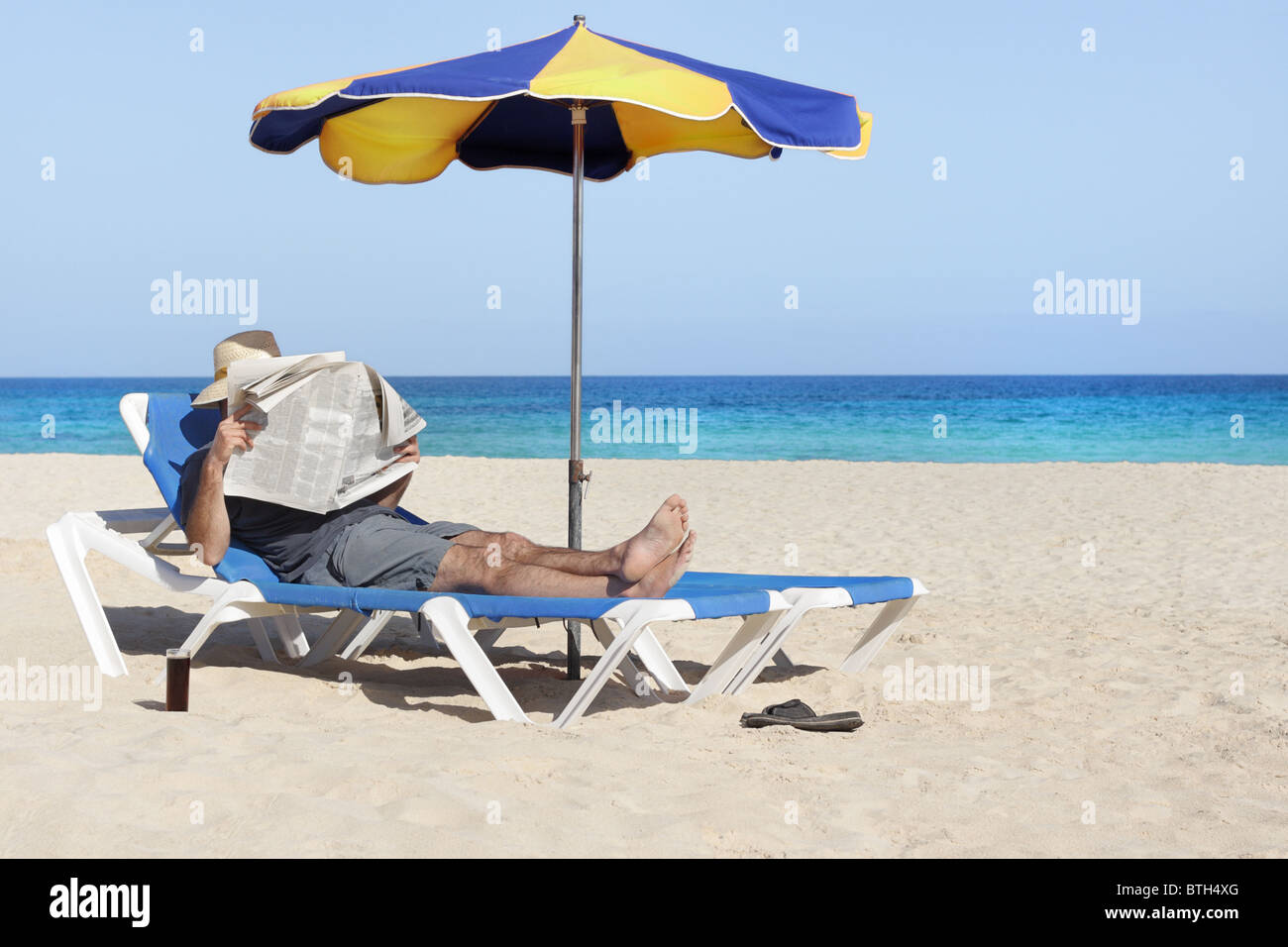 man relaxing in his beach lounger Stock Photo - Alamy