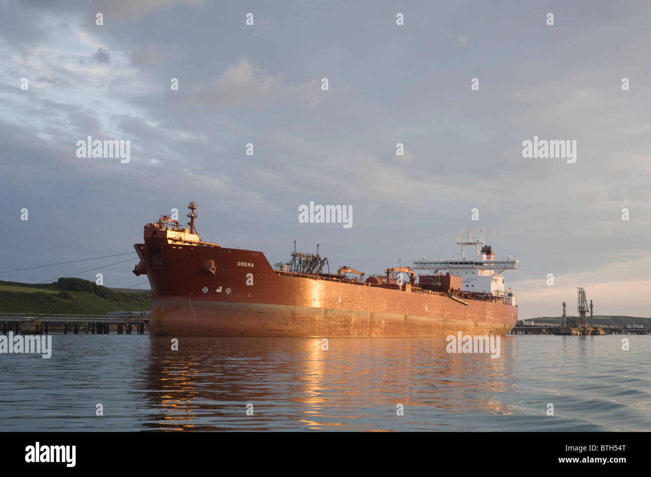 Oil tanker berthed at Texaco oil refinery jetty, Pembrokeshire, Wales ...