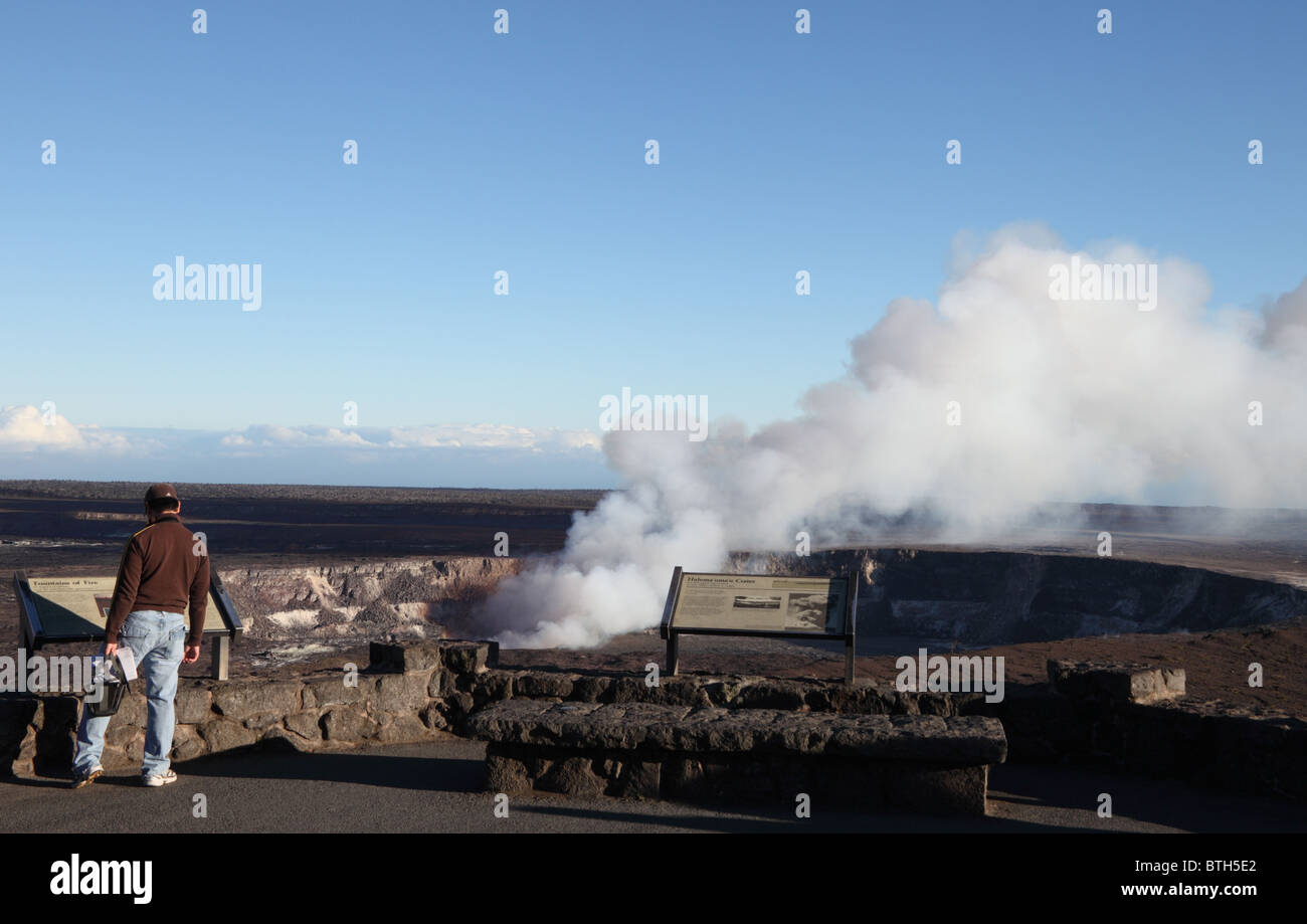 Tourist reads interpretive signs outside the Thomas A. Jaggar Museum at ...