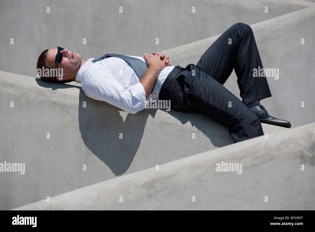 Man lying on one concrete hi-res stock photography and images - Alamy