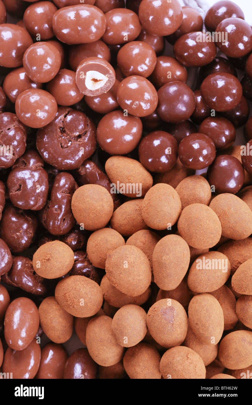 Variety of chocolate covered nuts - detail Stock Photo - Alamy