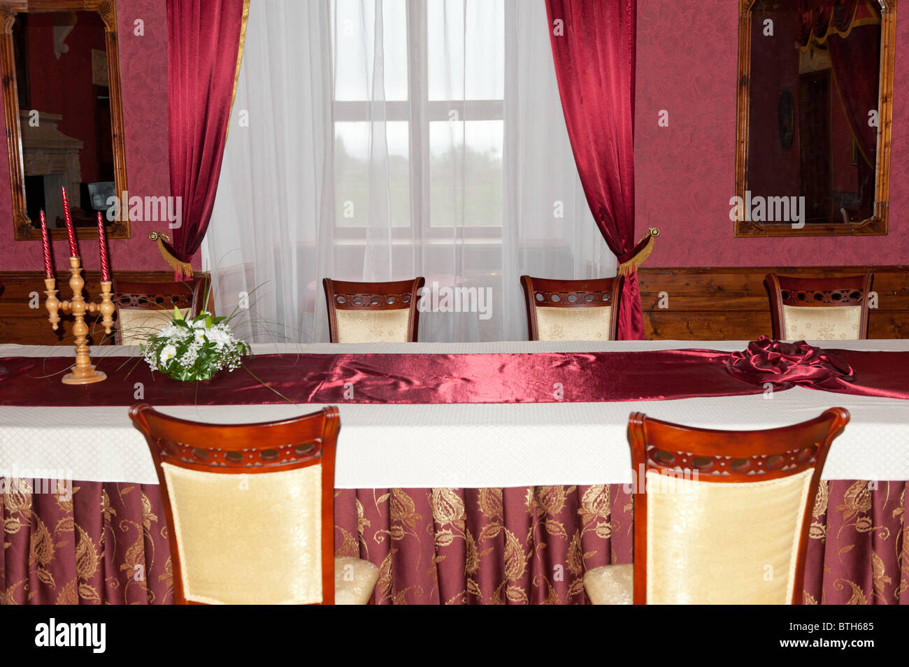 Dining table. An ancient table with chairs Stock Photo - Alamy