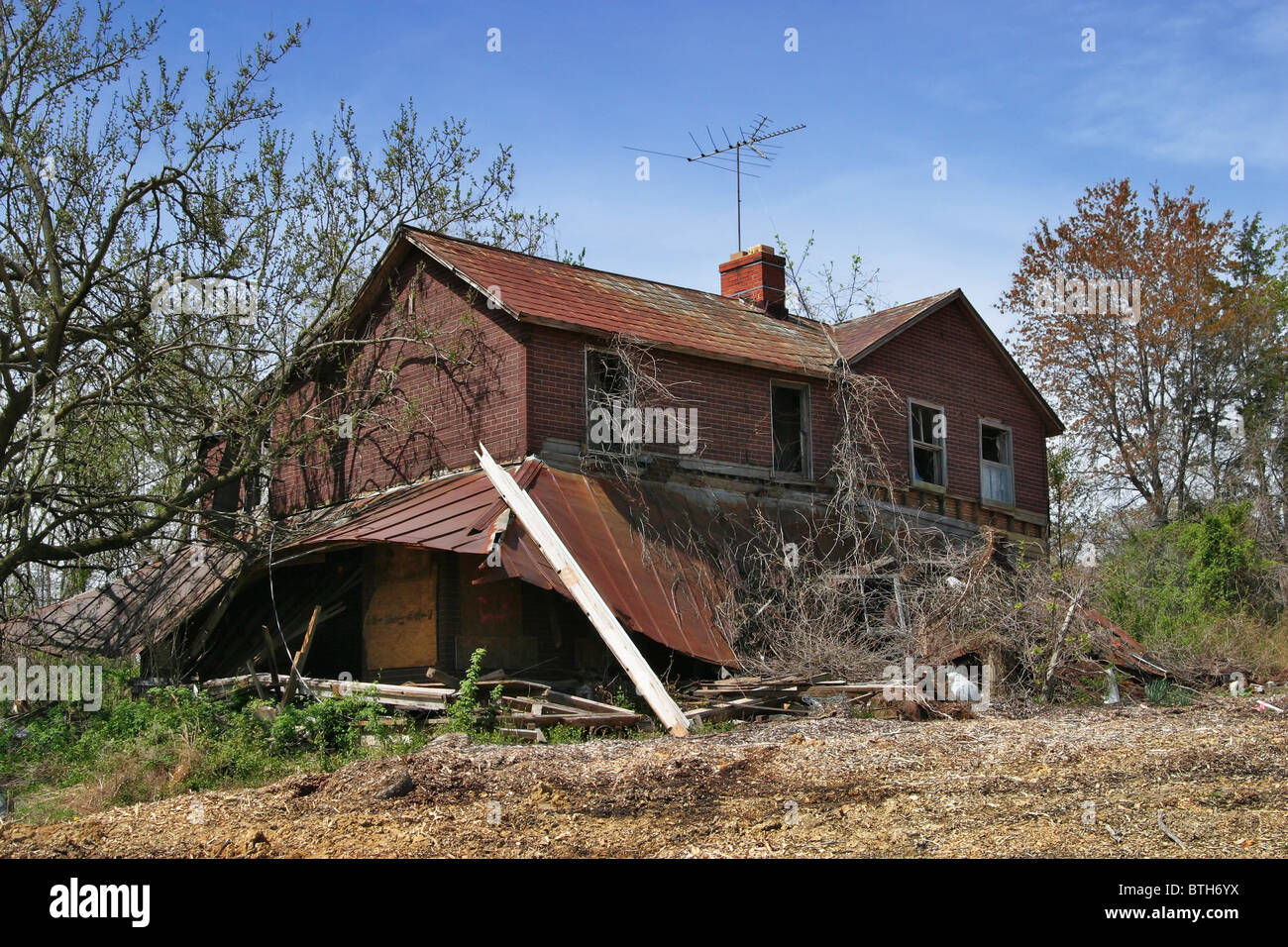 A neglected and rundown house completely overgrown Stock Photo - Alamy