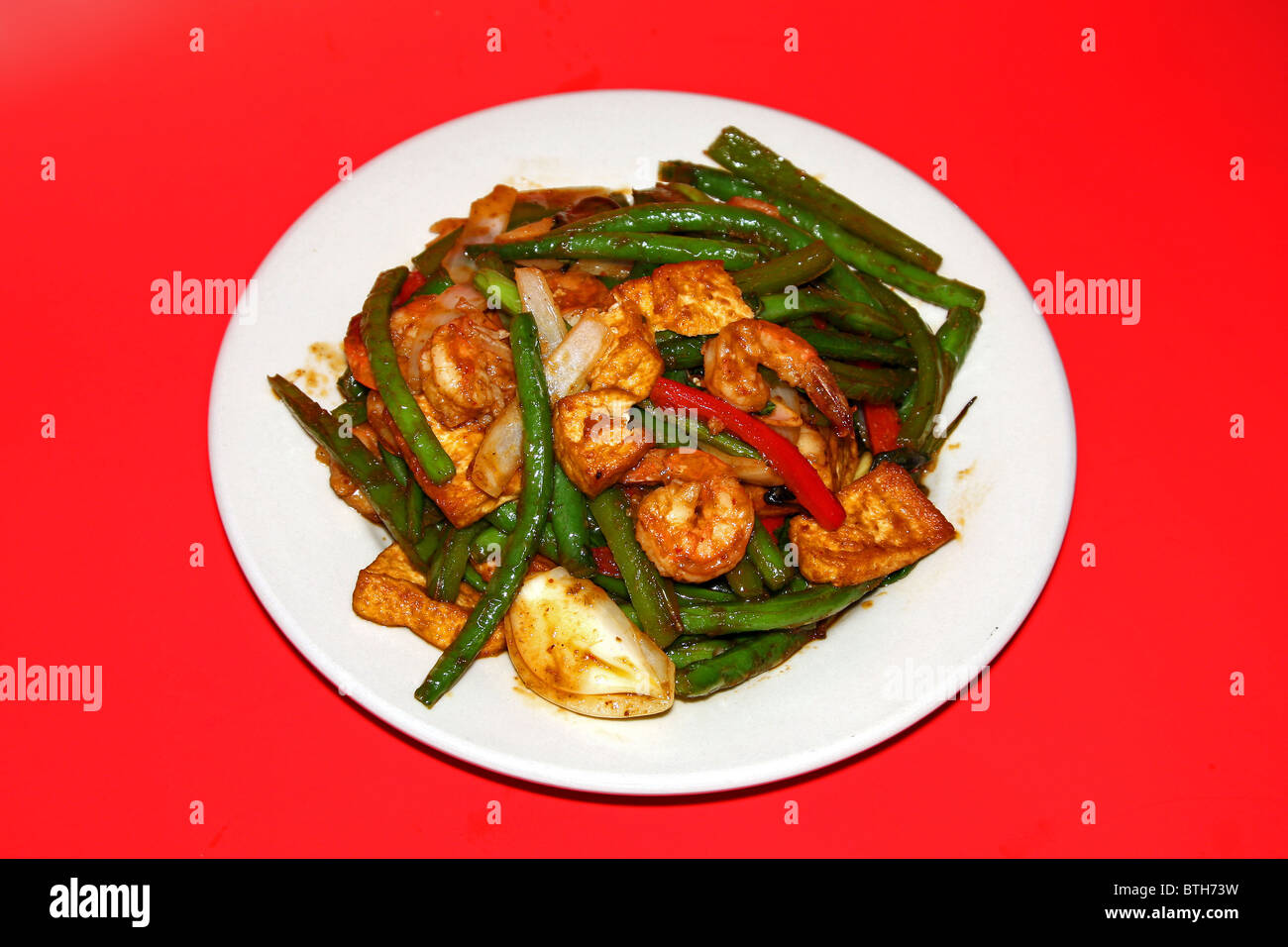 Sambal Udang shrimp. Chinese, Indonesian food on a red tablecloth ...