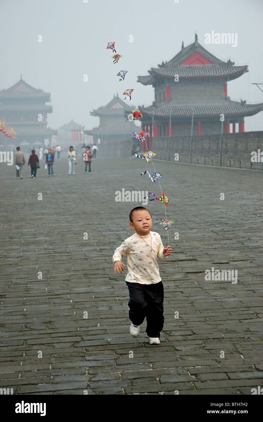 Chinese toddler flying kites at Xi'an China Stock Photo - Alamy