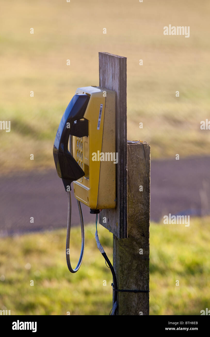 Outdoor telephone located by emergency gate at an airport Stock Photo ...
