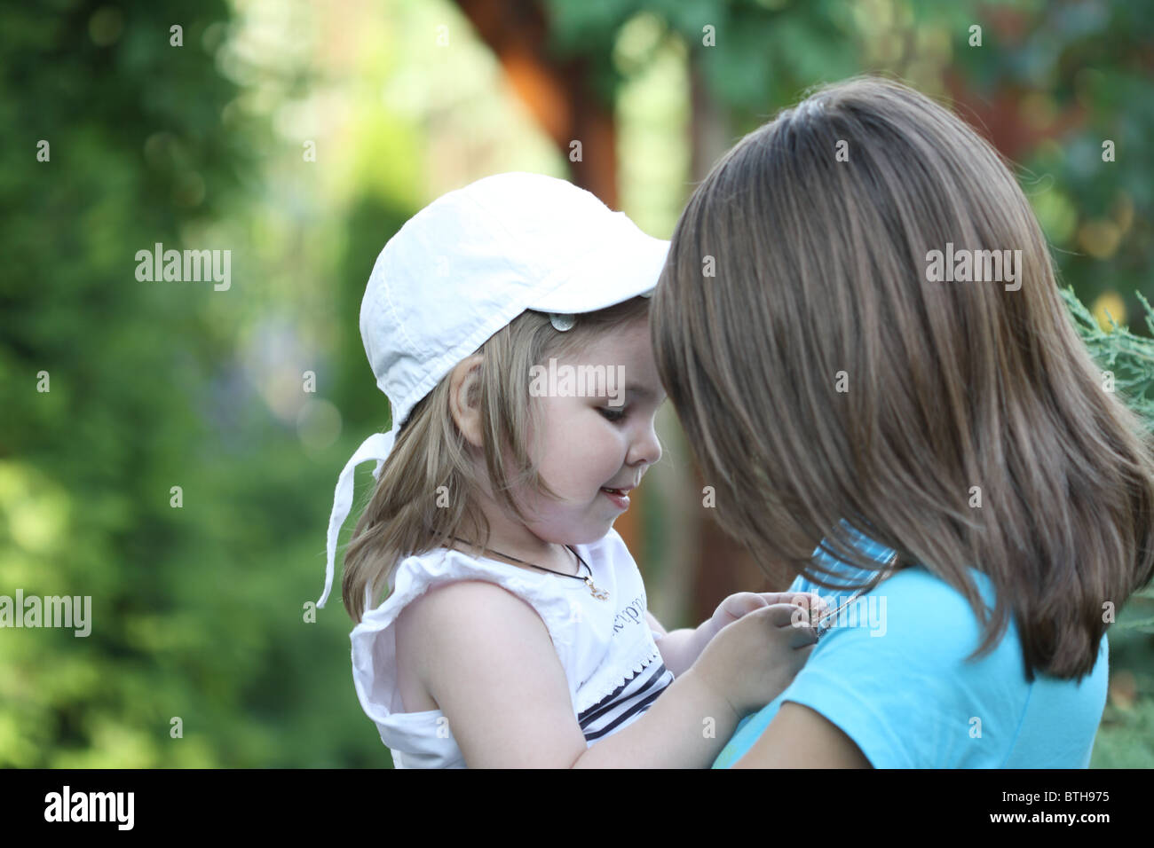 Two beautiful little sisters hi-res stock photography and images - Alamy