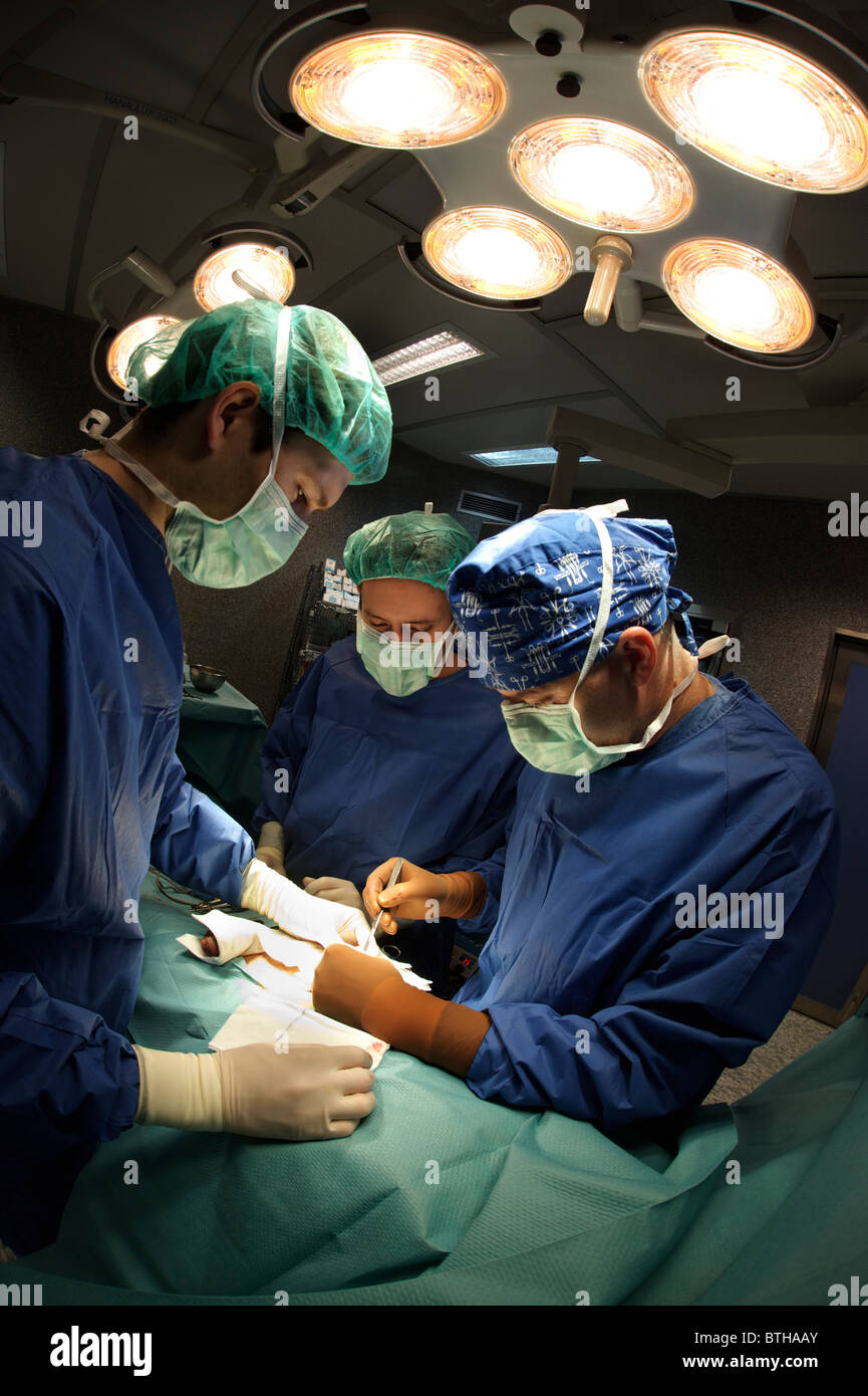 Doctors performing surgery in hospital operating room Stock Photo - Alamy