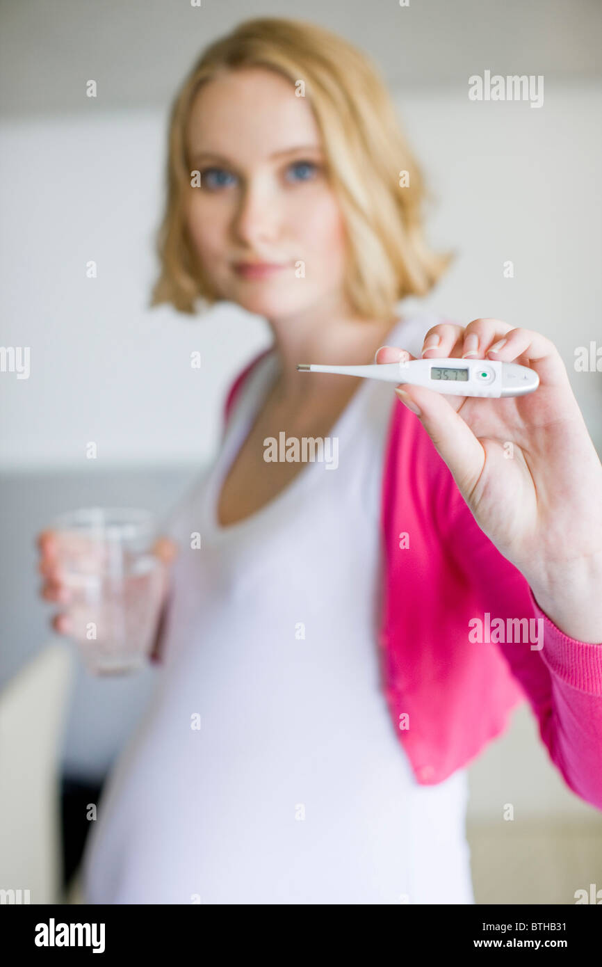 pregnant woman checking temperature Stock Photo - Alamy
