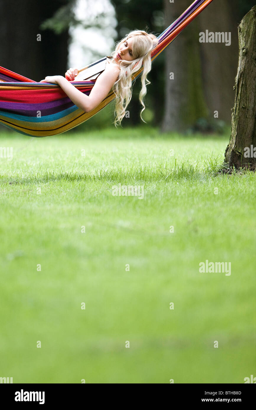 young woman relaxing on hammock Stock Photo - Alamy