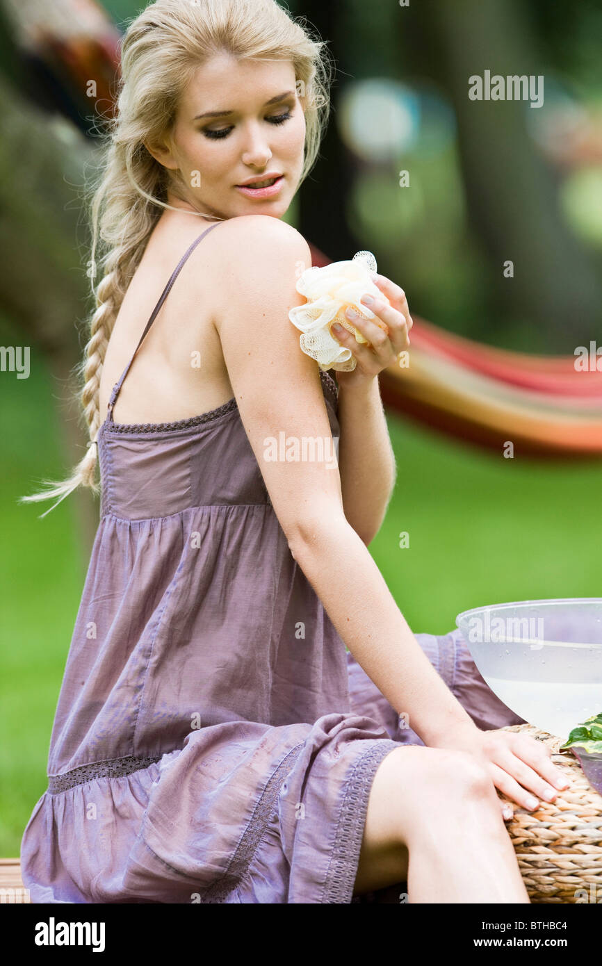 young woman washing body in garden Stock Photo - Alamy