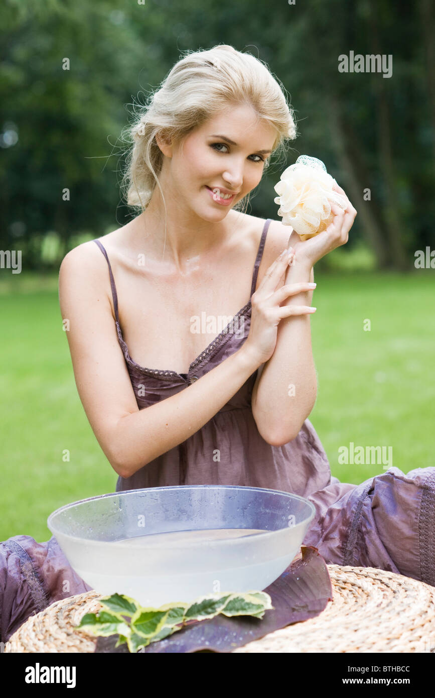 young woman washing body in garden Stock Photo - Alamy
