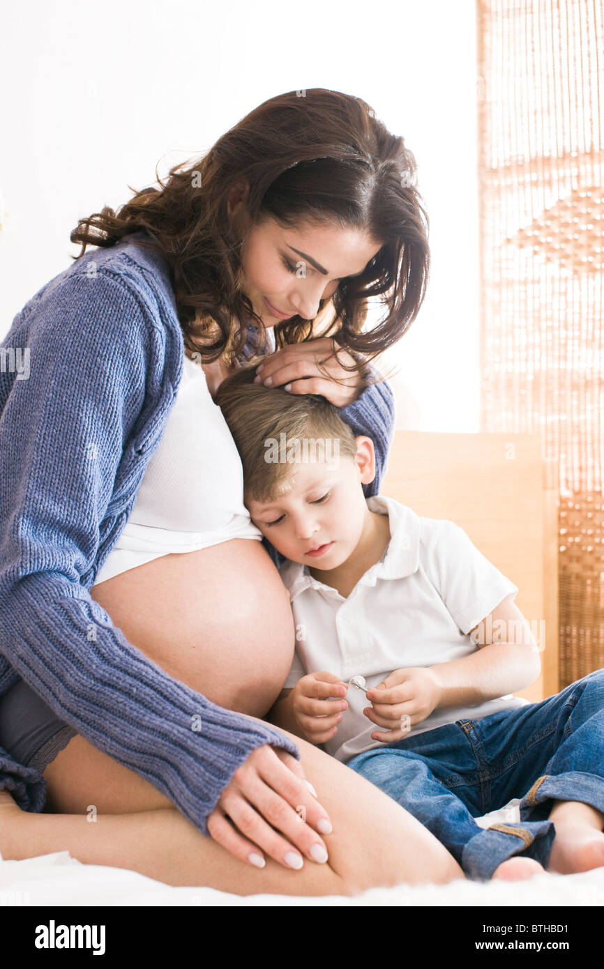 Mother hugging sad son Stock Photo - Alamy