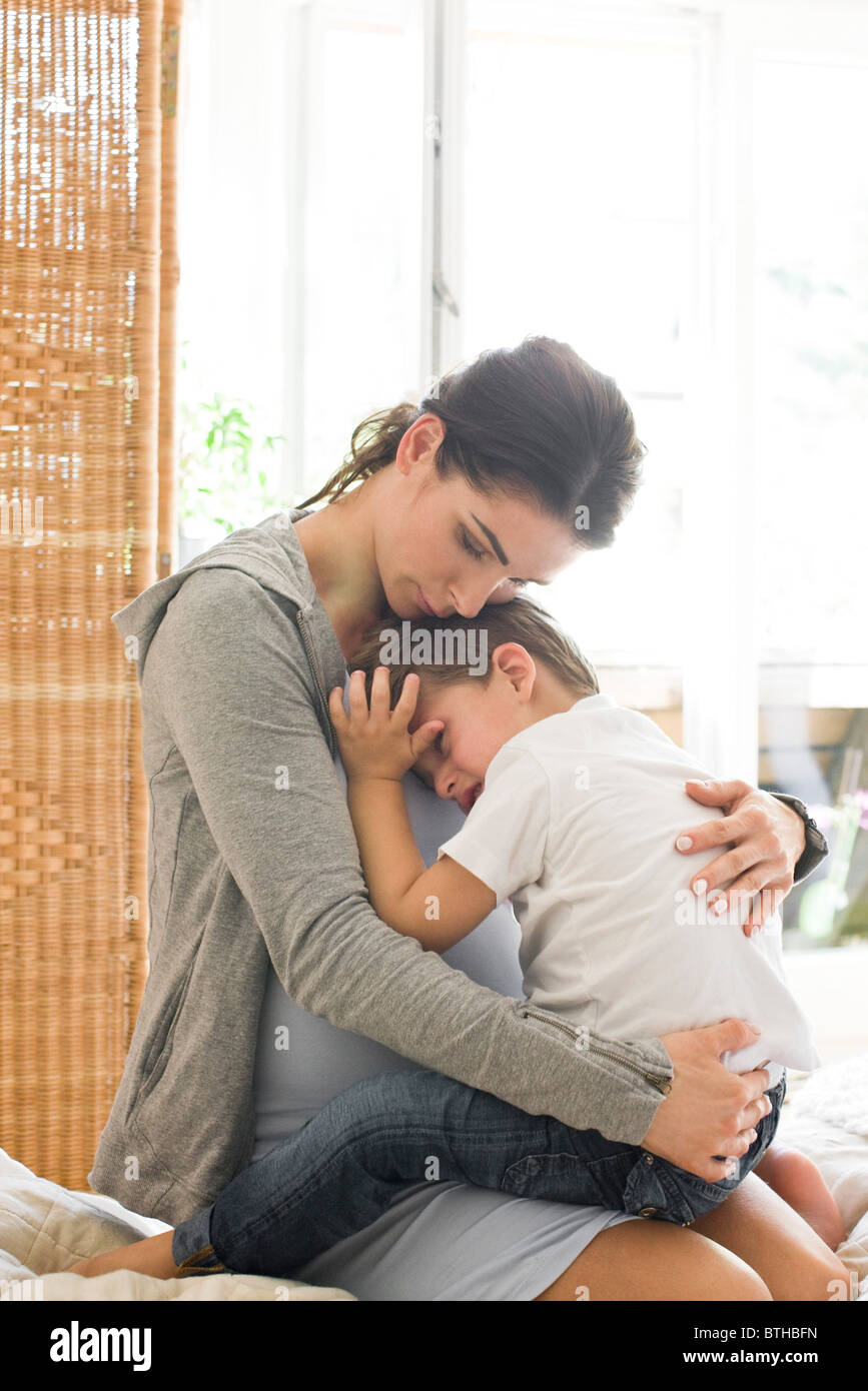 Mother hugging sad son hi-res stock photography and images - Alamy
