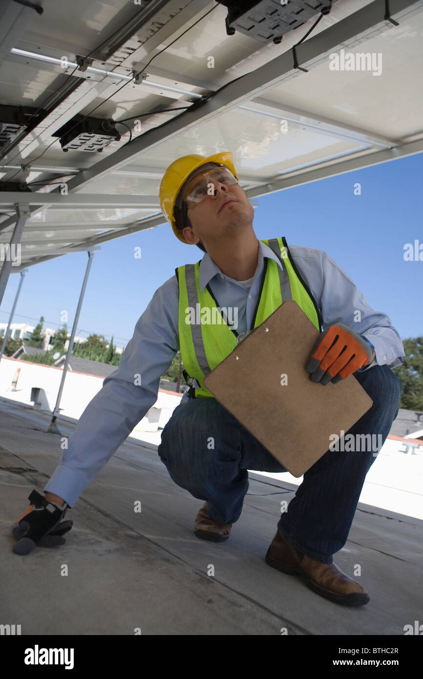 Maintenance worker checking solar panel in Los Angeles, California ...