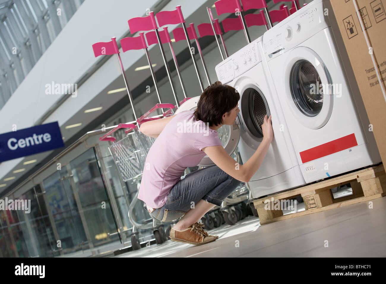 Woman washing machine shopping hi-res stock photography and images - Alamy