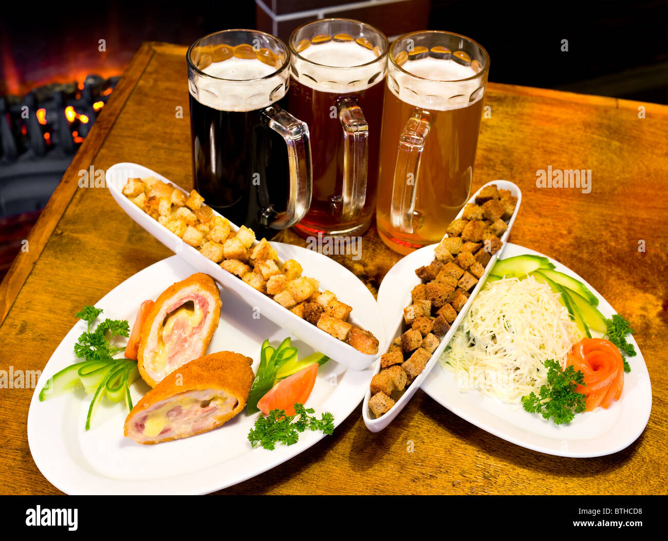 three glasses of different beer with snack Stock Photo - Alamy
