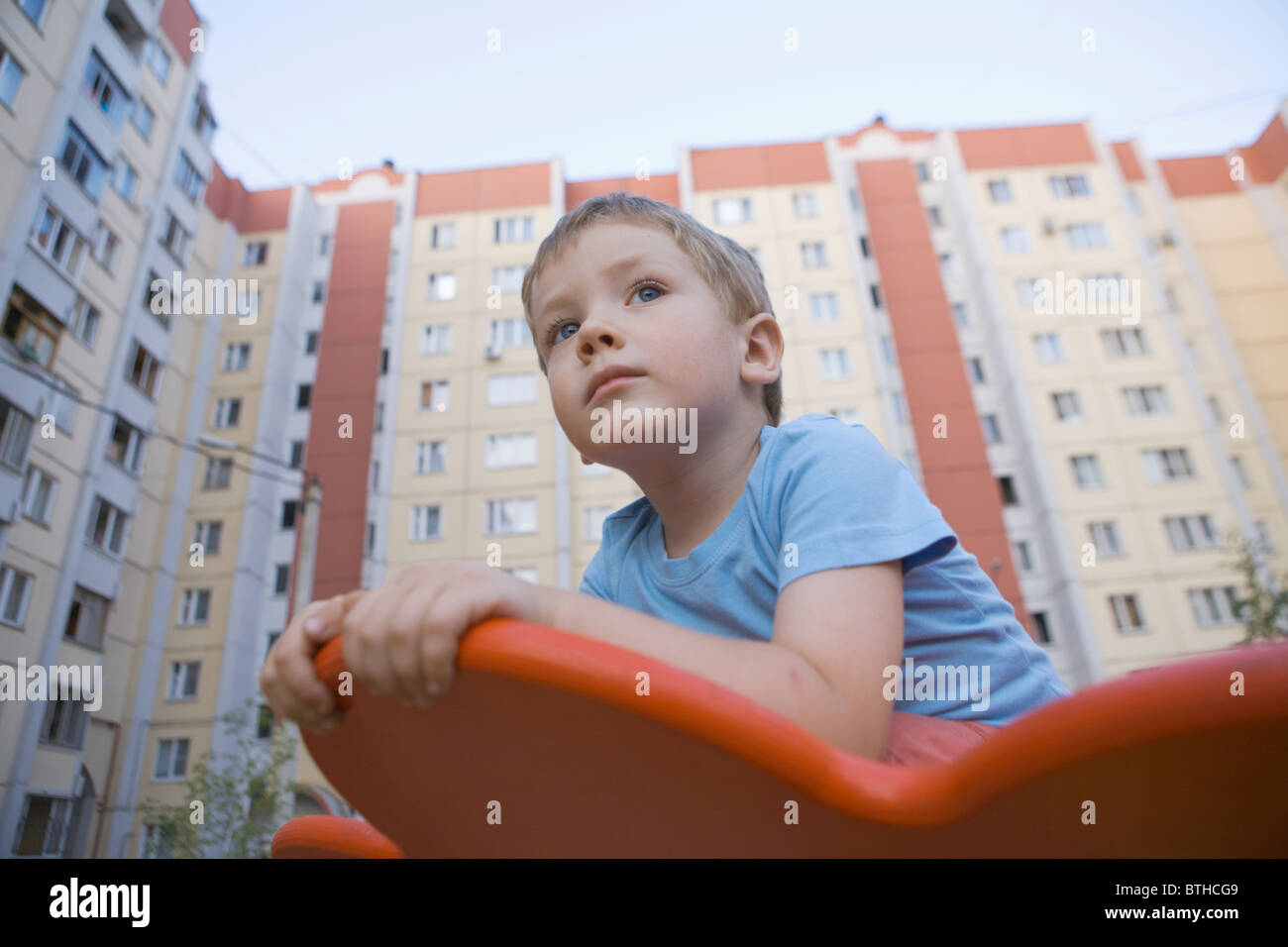 Young boy in playground Stock Photo - Alamy