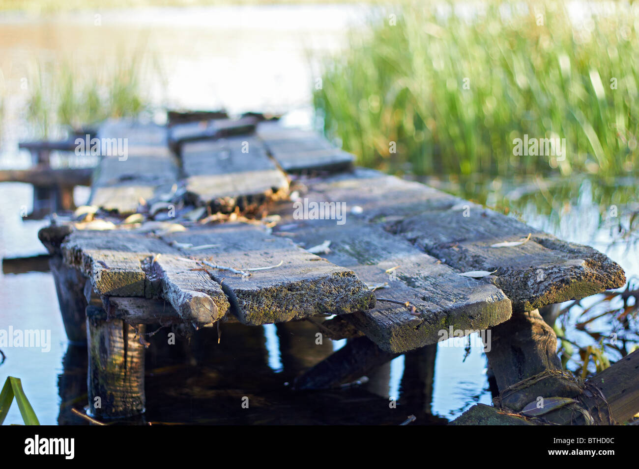 Old wooden bridge on river Stock Photo - Alamy