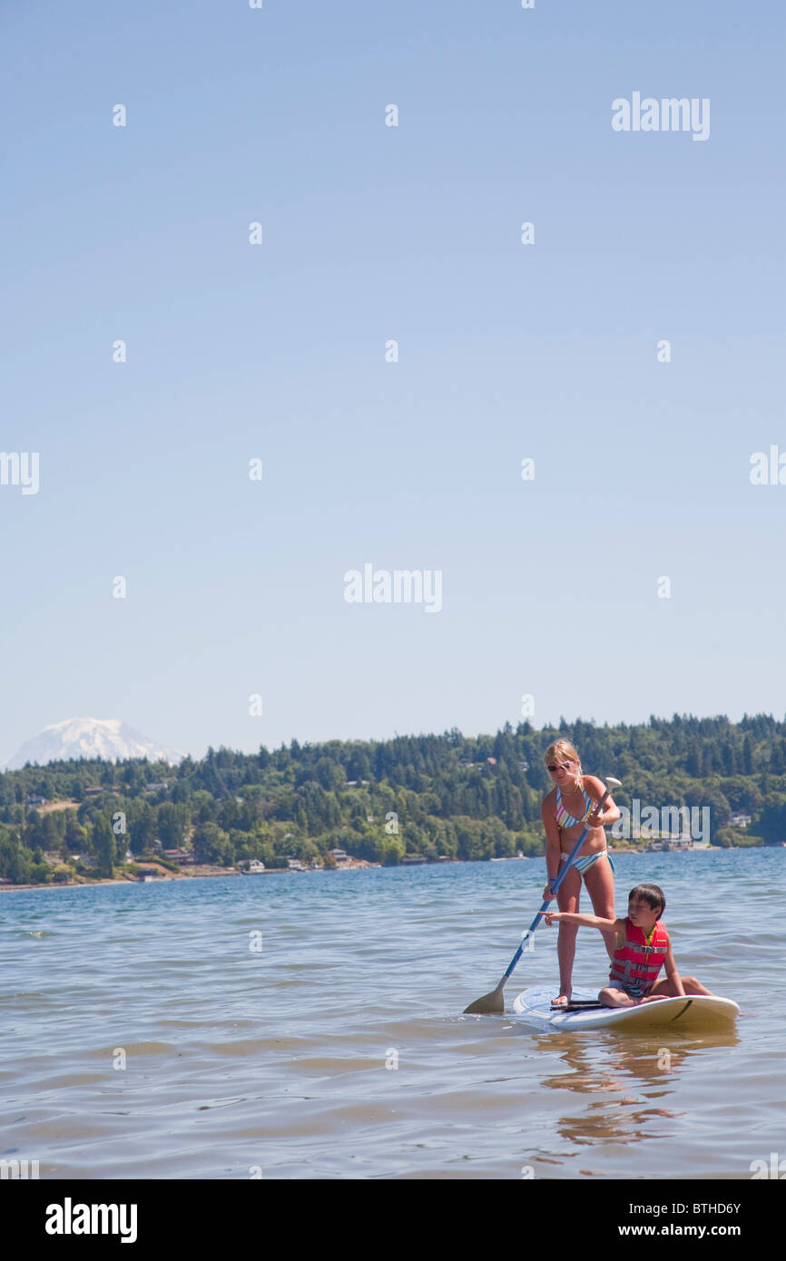 Boy girl on paddle board hi-res stock photography and images - Alamy