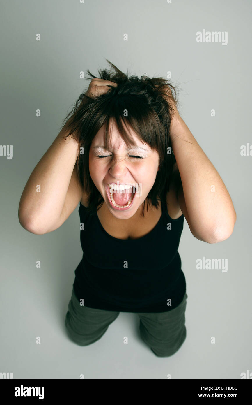 Woman expression crazy madness insane hi-res stock photography and ...
