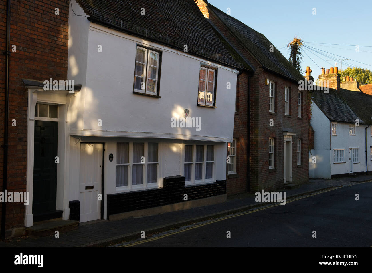 A white historic building with a jettied upper storey known as jettying ...