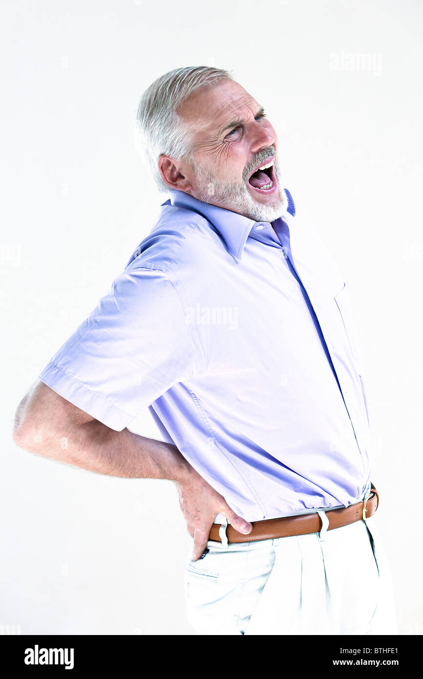 caucasian senior man portrait screaming backache isolated studio on ...