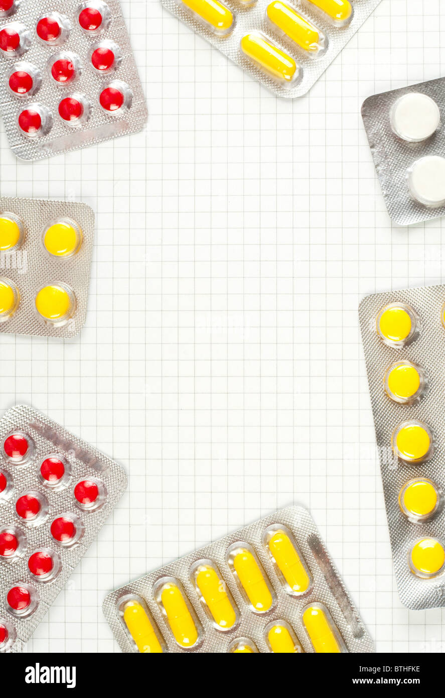 Medicine on checked paper background Stock Photo - Alamy