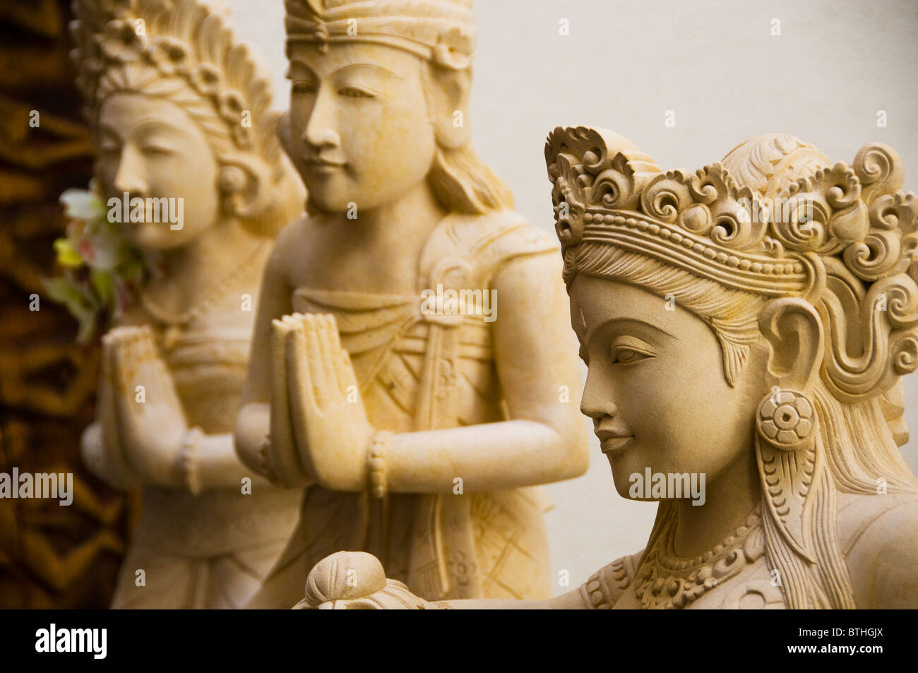 Three praying female statues Stock Photo - Alamy