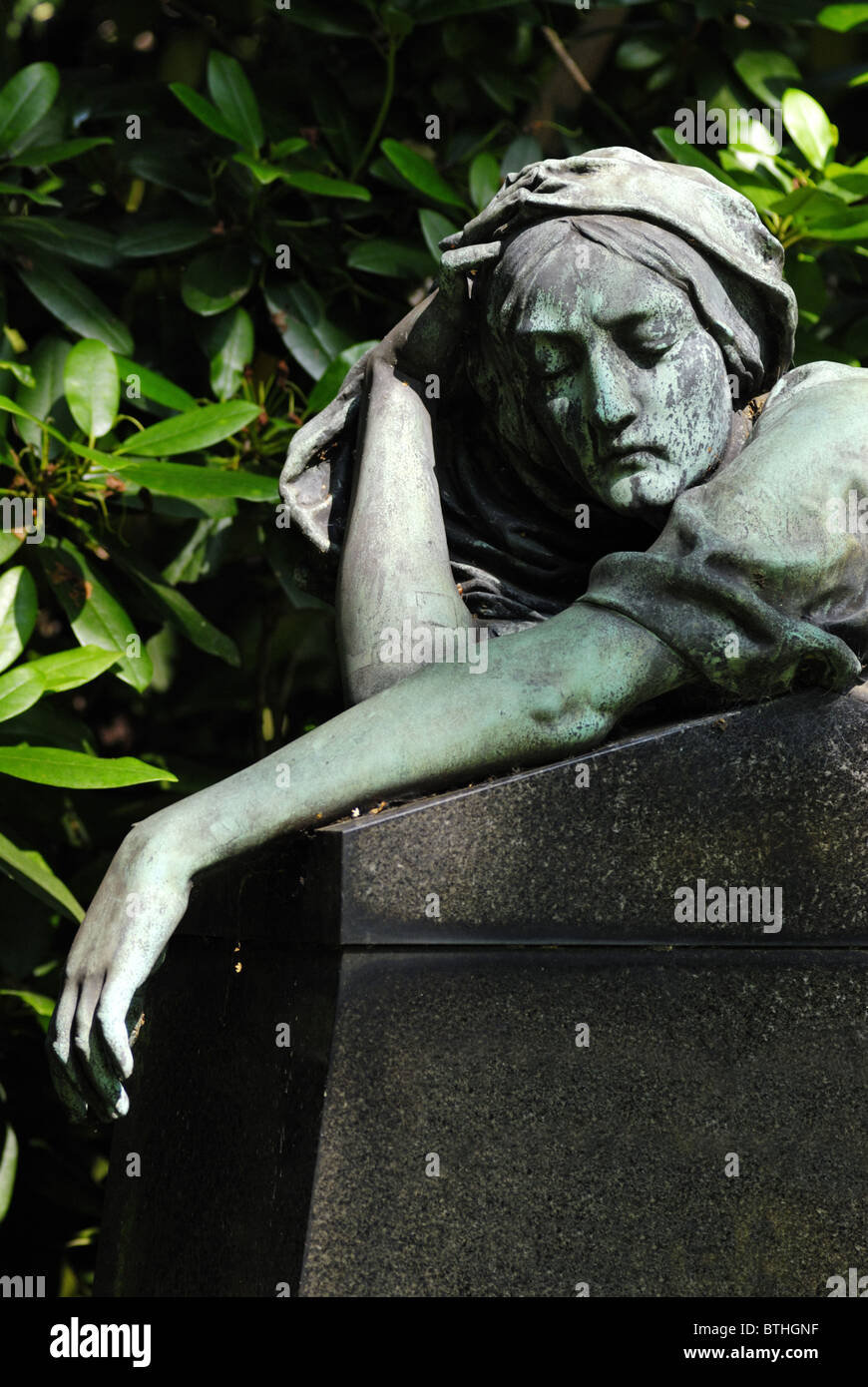 Historic statue of a grieving woman at the Ohlsdorf cemetery in Hamburg ...
