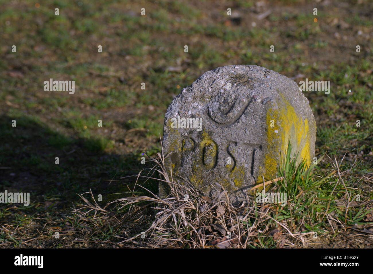 Postal stone on a path Stock Photo - Alamy