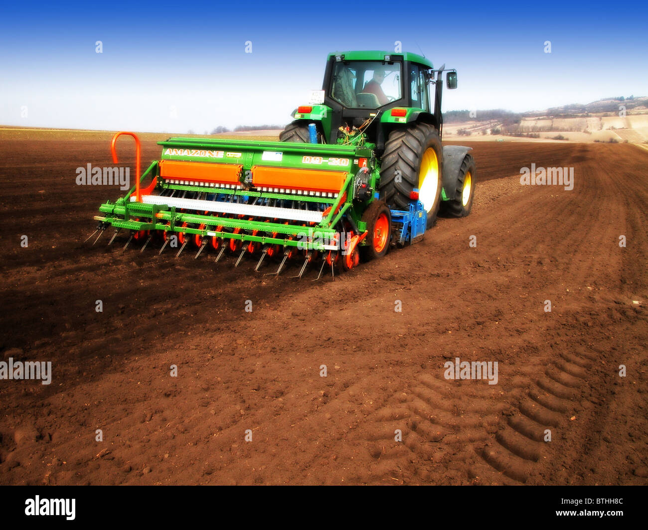 Tractor with planter Stock Photo - Alamy