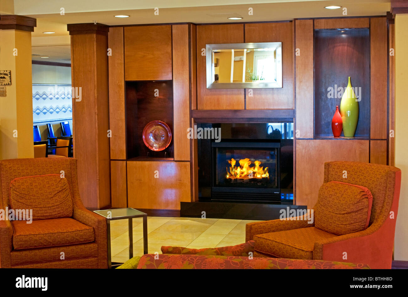 Interior of hotel lobby with fireplace and decorations Stock Photo - Alamy