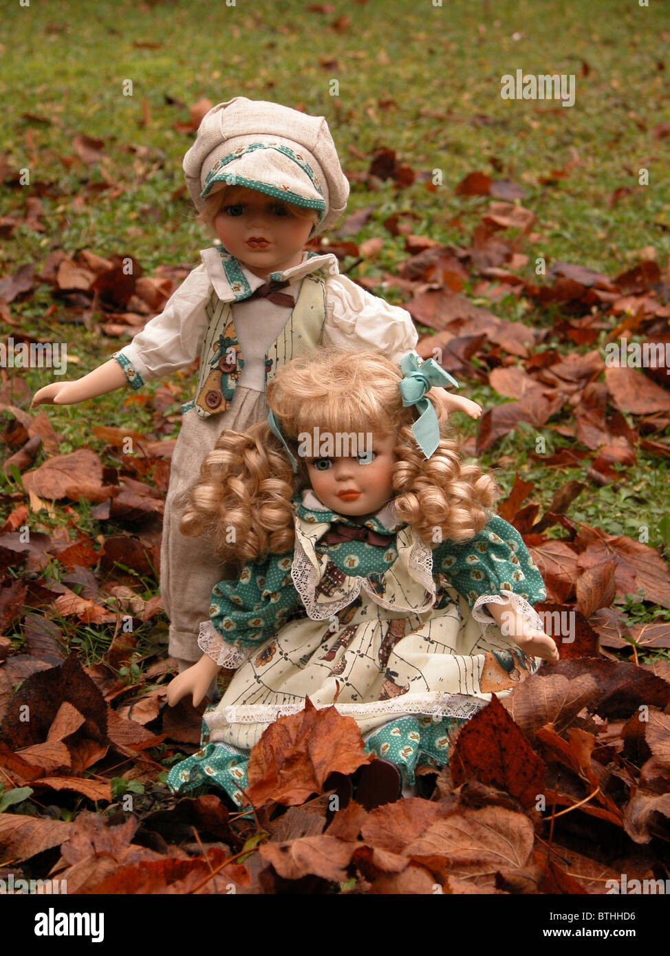 Dolls couple in autumn Stock Photo - Alamy