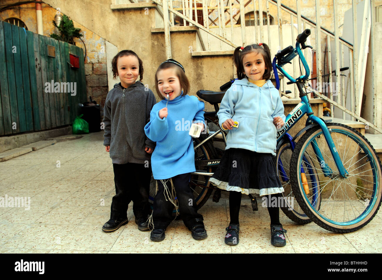 Cute Jewish Orthodox kids playing near their home in Mea Shearim ...