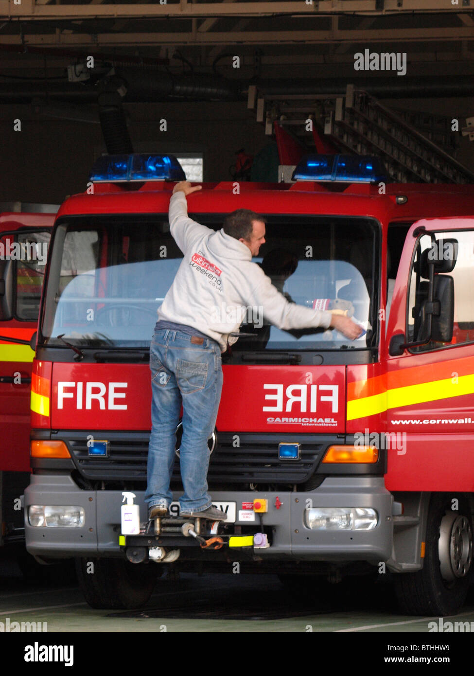 Cleaning a fire engine, Cornwall, UK Stock Photo - Alamy
