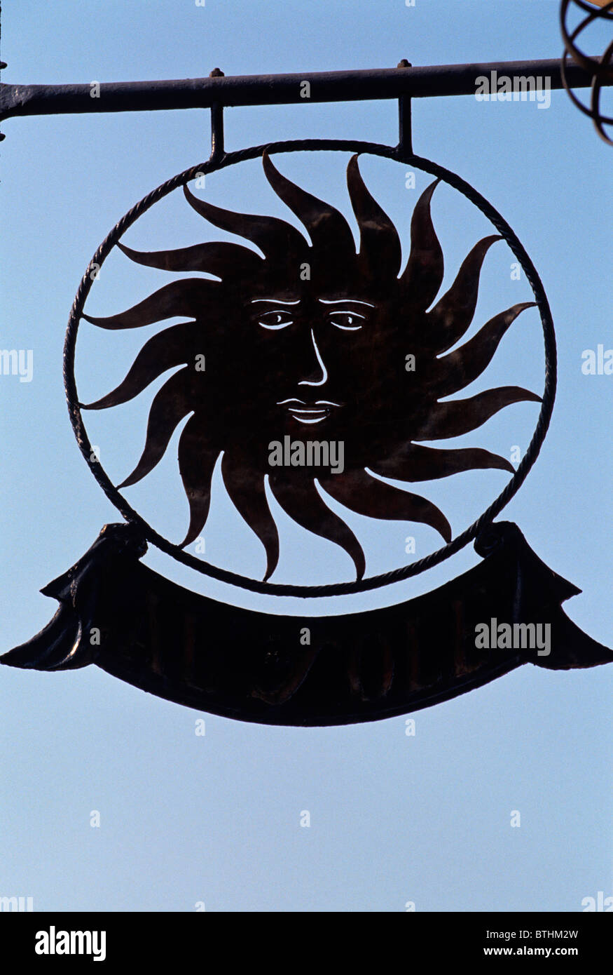 A shop sign of the sun on a building in Venice Stock Photo - Alamy