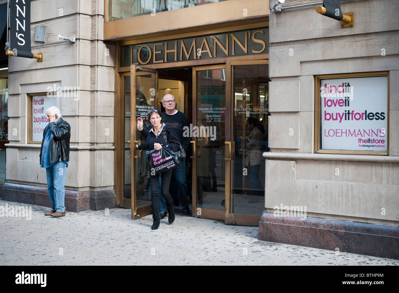 Shoppers enter and leave a Loehmann's department store in New York ...