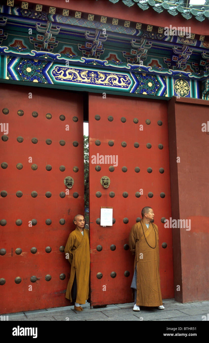 Buddhist monks stand at the gate of their temple. Henan,China Stock ...