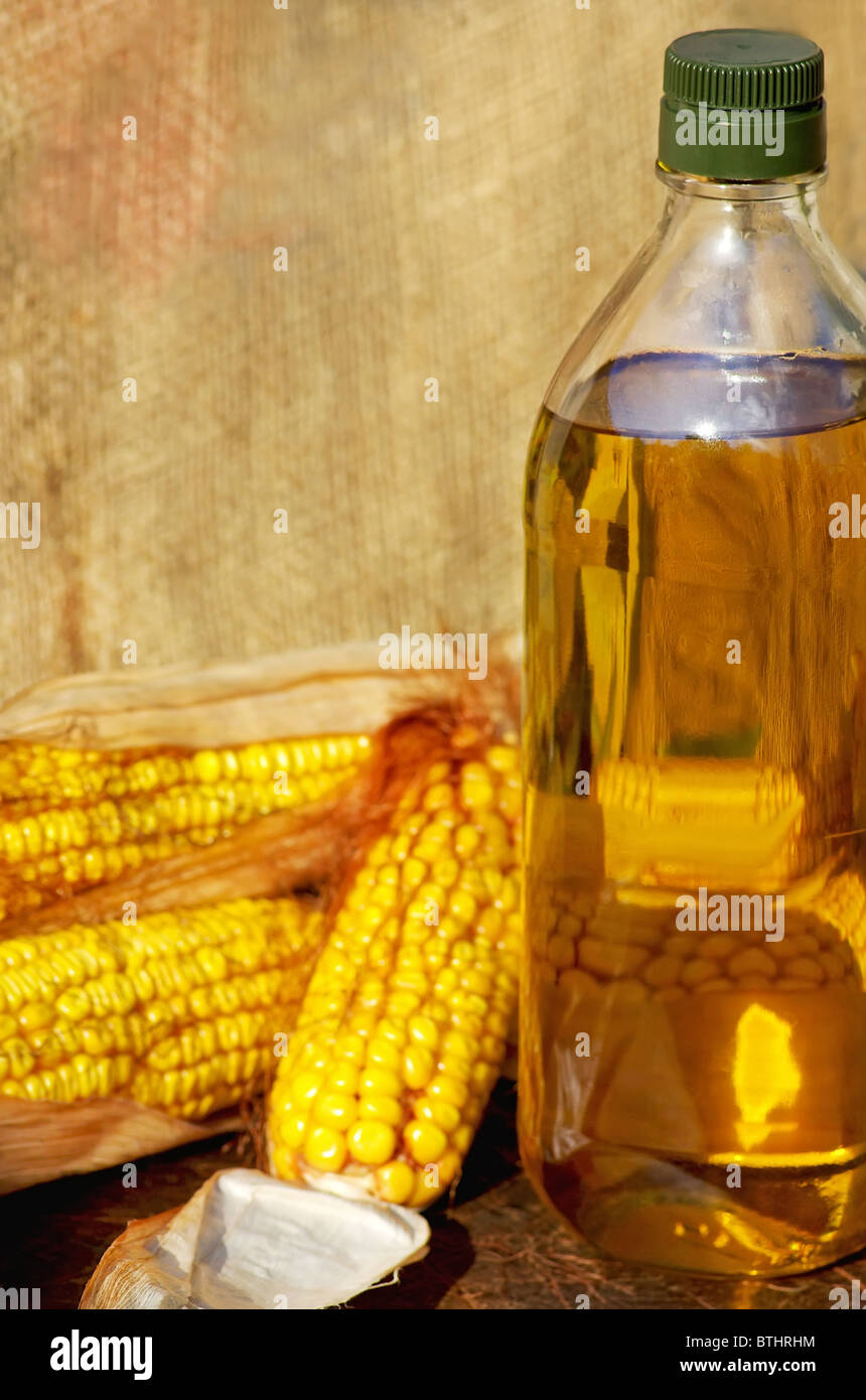 Yellow corn and bottle of oil Stock Photo - Alamy