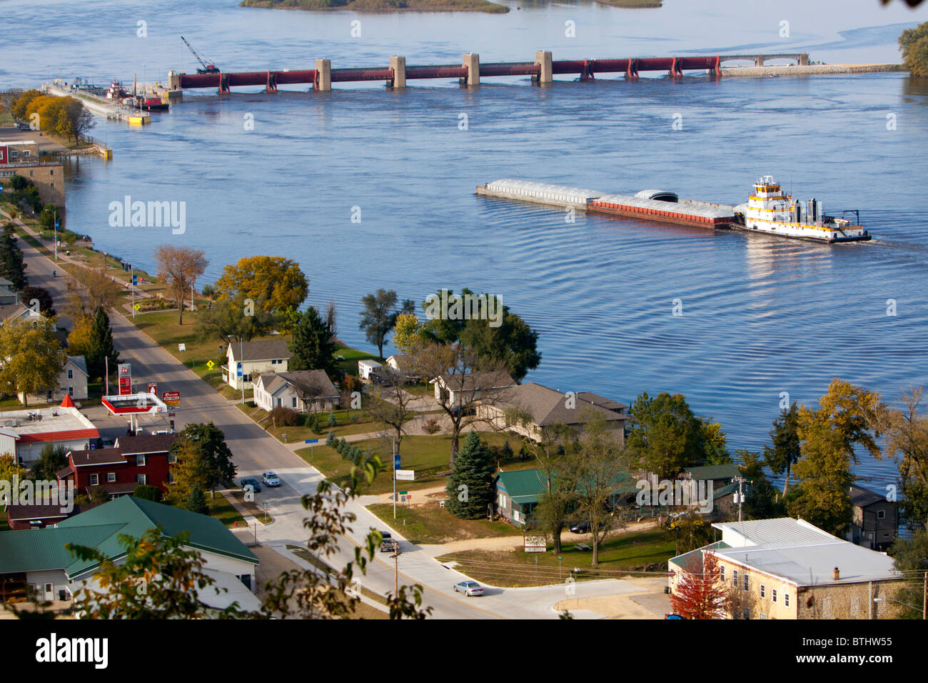 Heading for the lock at Bellevue, Iowa, a barge heads up the ...