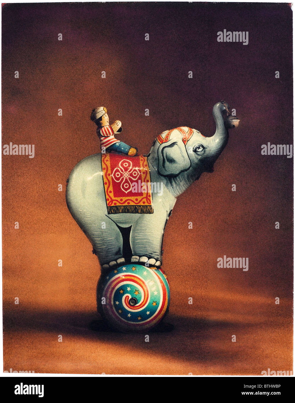 Polaroid transfer of tin toy elephant with rider Stock Photo - Alamy