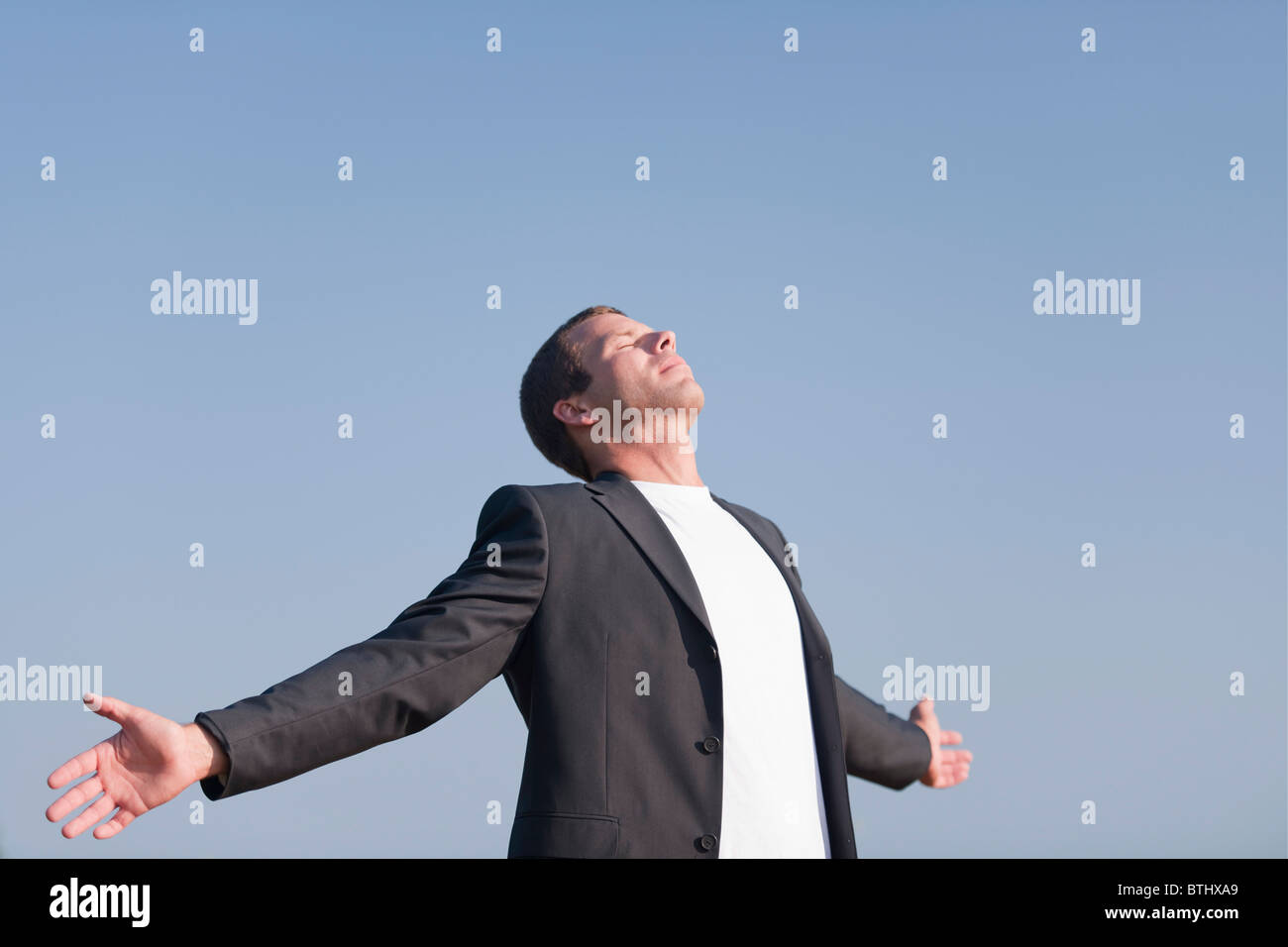 Man in suit arms out hi-res stock photography and images - Alamy