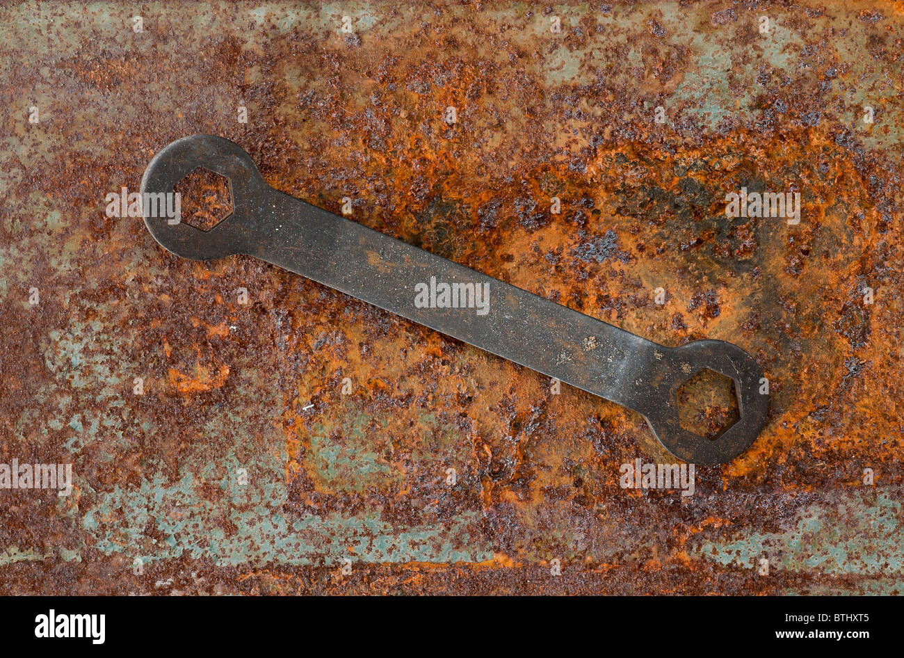 Old Spanner on a rusty background Stock Photo - Alamy