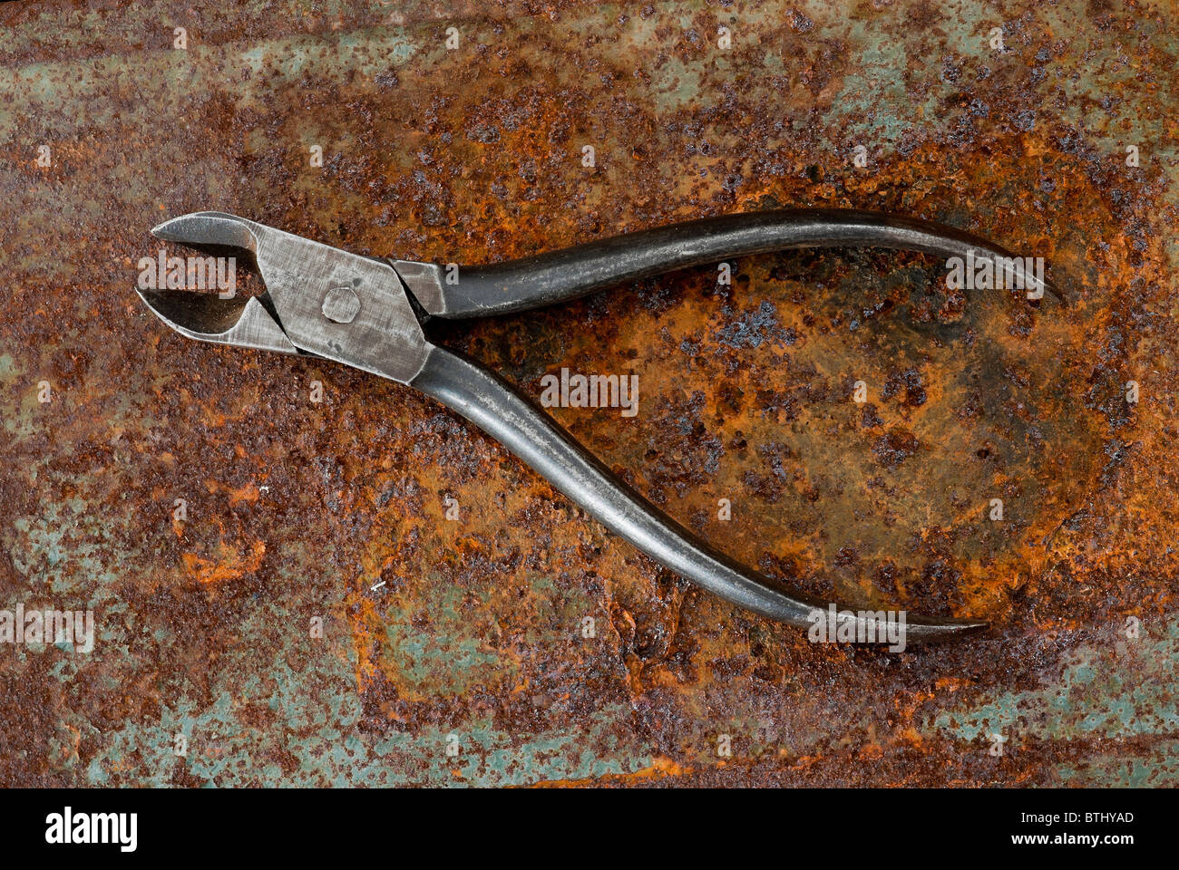 Pair of Diagonal Pliers or Wire Cutters on a rusty background Stock ...