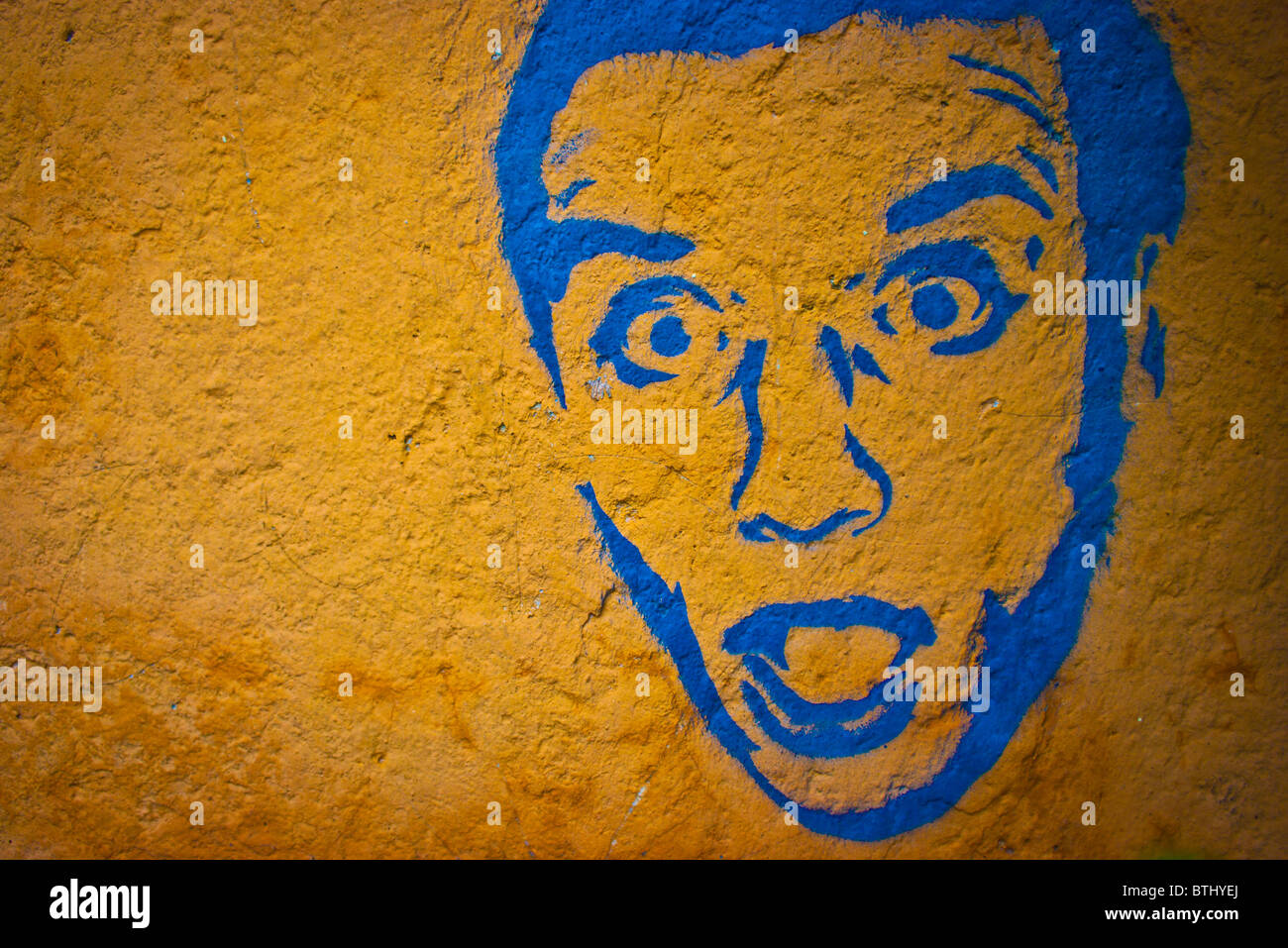 Man with yellow paint on his face hi-res stock photography and images ...