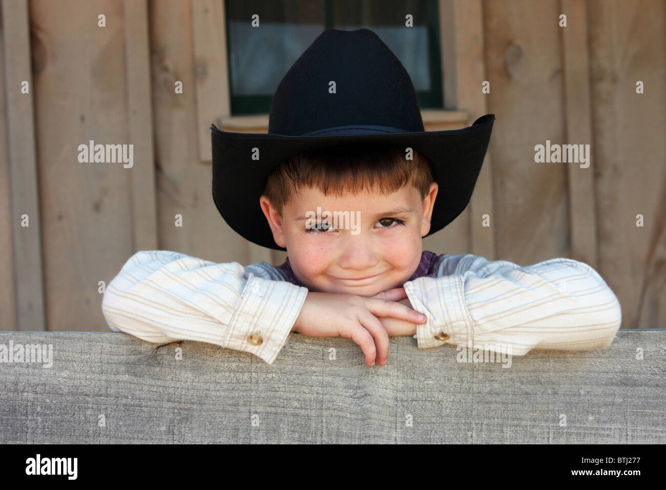 A portrait of a smiling young cowboy in an old west town Stock Photo ...