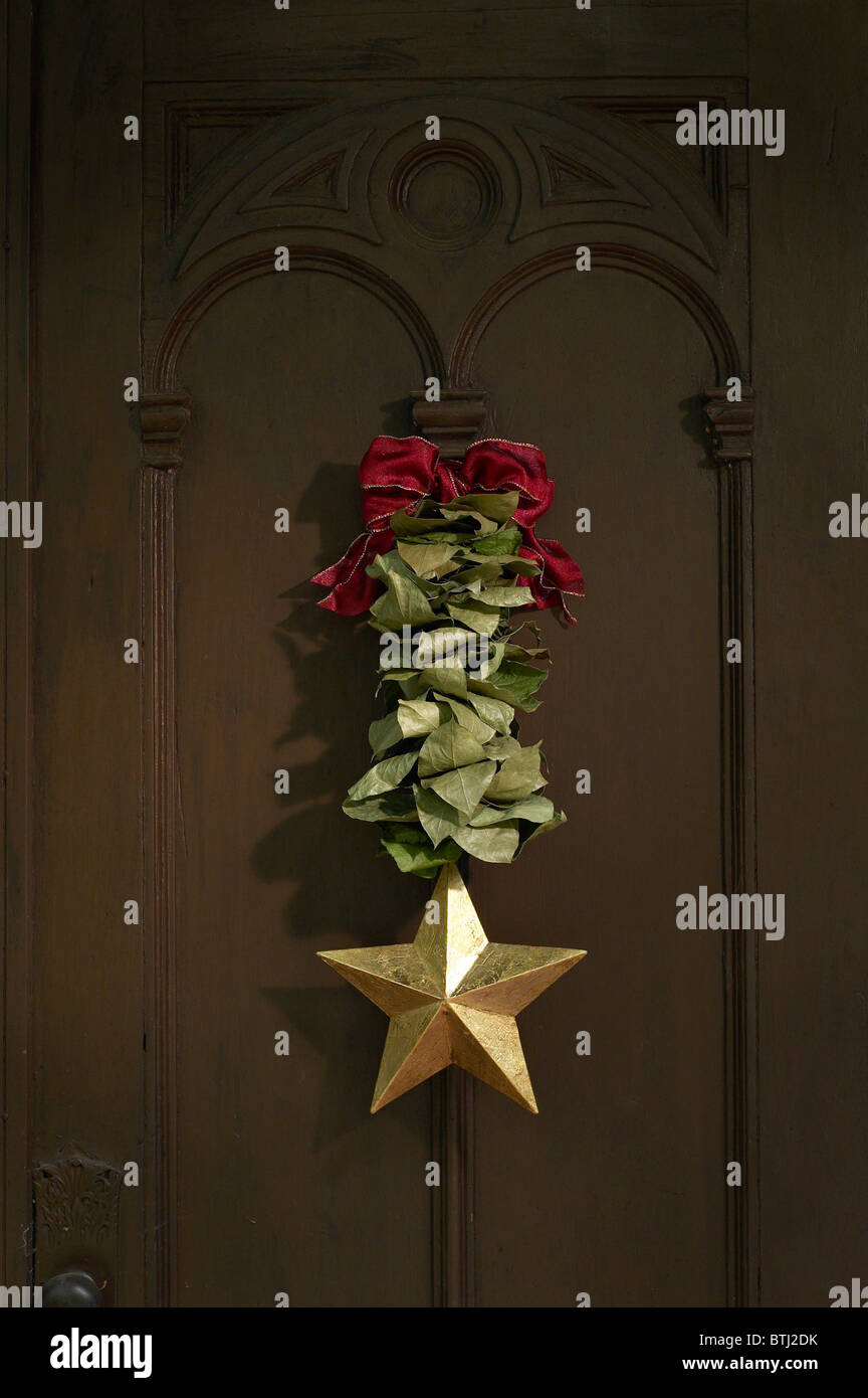 A golden star christmas wrath on a door Stock Photo - Alamy