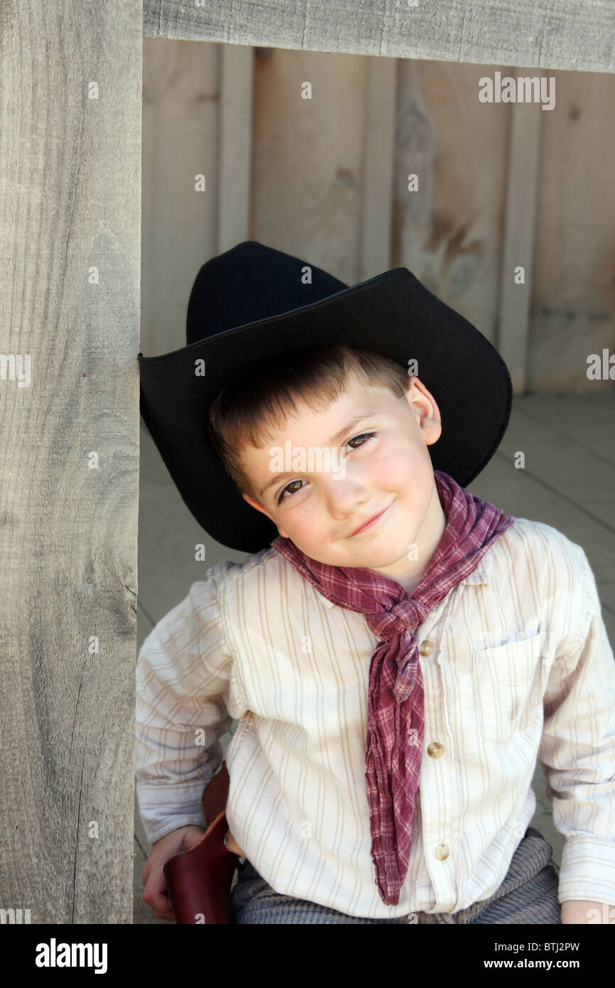 A portrait of a smiling young cowboy in an old west town Stock Photo ...
