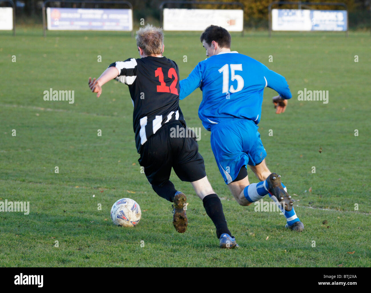 Footballers tackle hi-res stock photography and images - Alamy